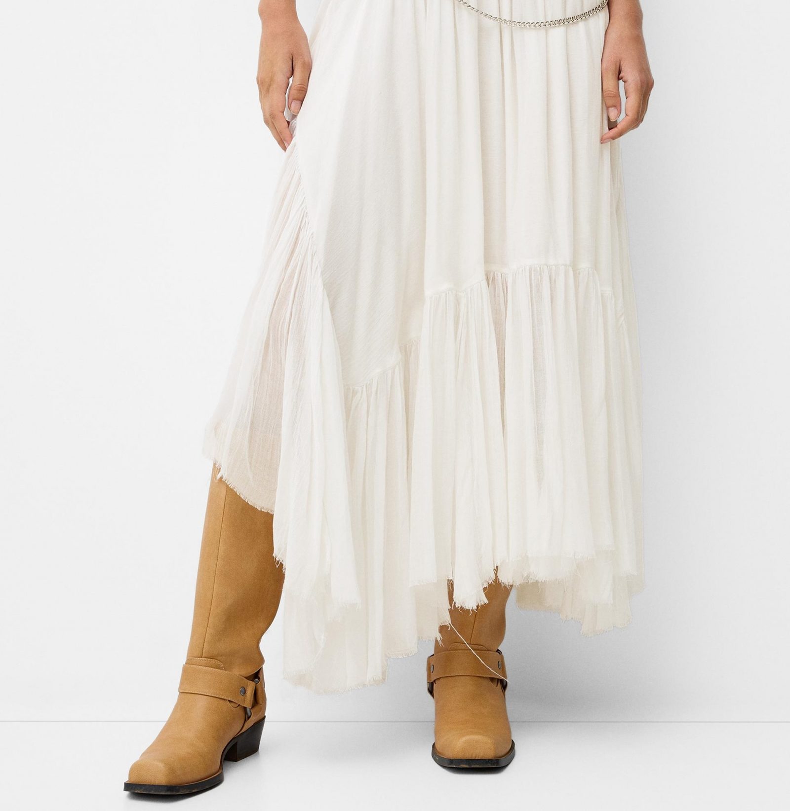 Botas altas con falda: la mezcla perfecta para otoño